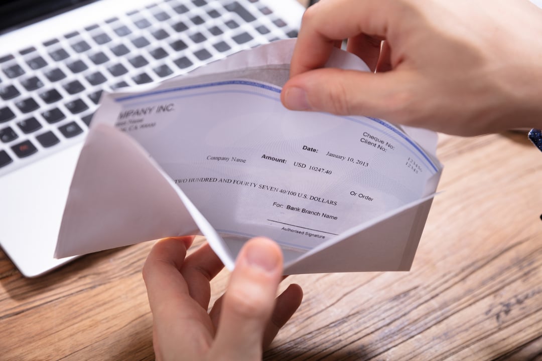 3 Stocks That Cut You a Check Each Month | The Motley Fool